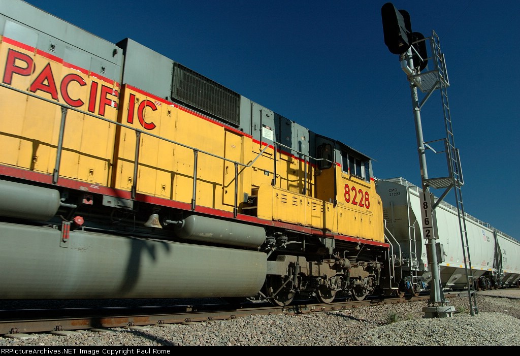 UP 8228 brings up the rear as a DPU remote unit on a southbound grain train